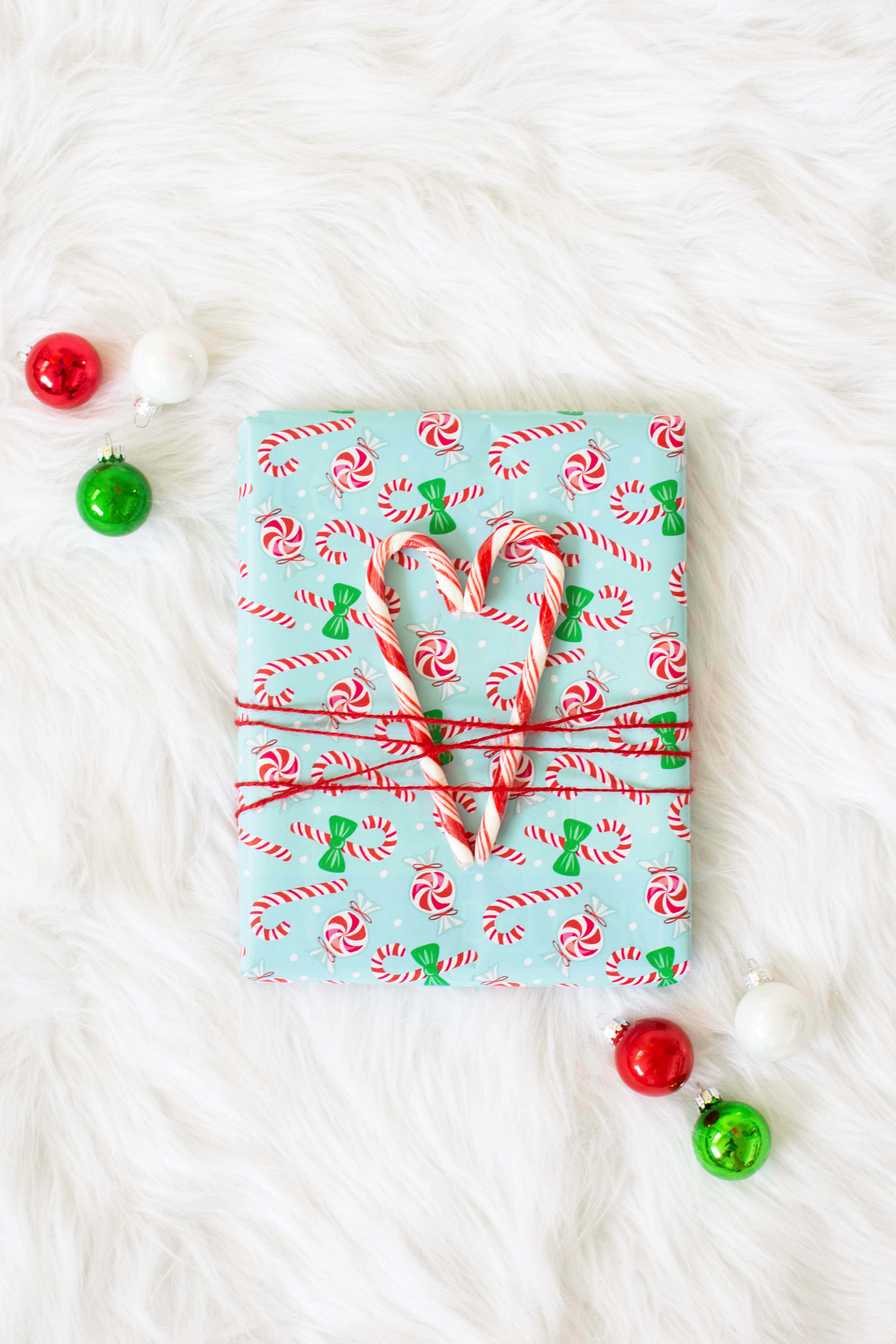 Steal These Holiday Gift Wrapping Ideas - DIY candy cane themed paper